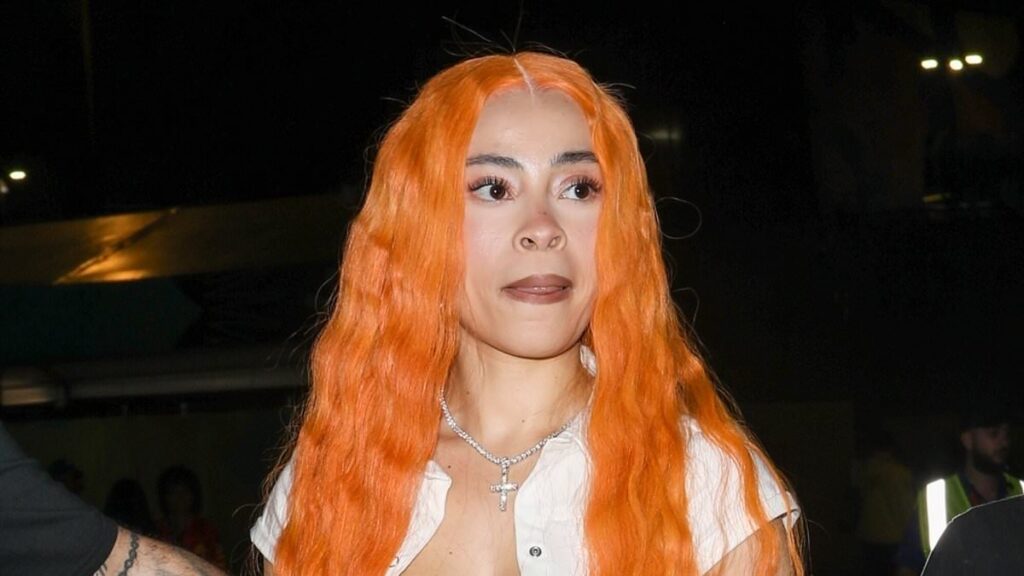 Taylor Alert - Ice Spice wears a red lace bra with denim hot pants as ...